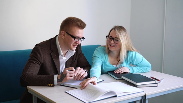 Positive Male and Female Students Doing Homework Together Spending Time ...