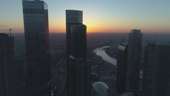 Aerial View of Skyscrapers and City Skyline at Sunny Sunrise, Stock Footage