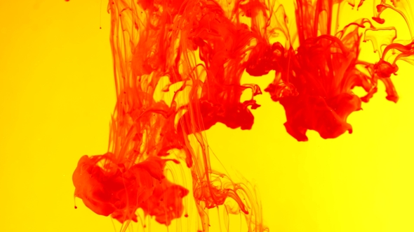 Ink in Water. Red Paint on Yellow Reacting in Water Creating Abstract ...