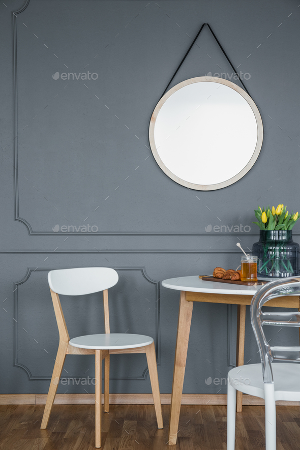 Round mirror above dining set Stock Photo by bialasiewicz | PhotoDune