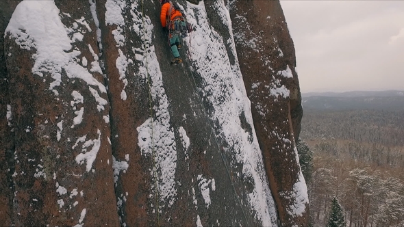Aerial View of a Rock Climber Climbing a Steep Cliffs during a Sunny ...