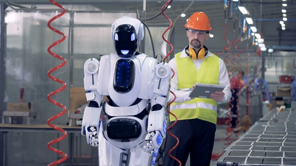 Drilling Process Performed By a Cyborg Is Being Controlled By a Factory ...