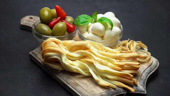 Video of Smoked Braided Cheese, Mozzarella and Olives, Stock Footage