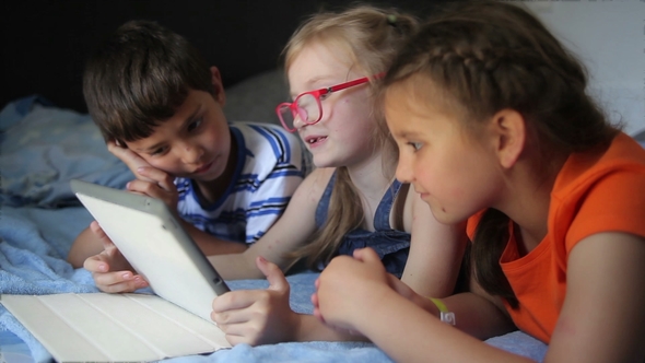 Children Are Watching a Movie on a Tablet, Stock Footage | VideoHive