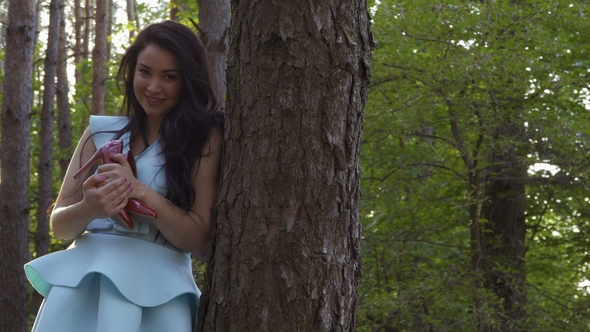 Beautiful Dreaming Woman Lean on Tree Trunk in Forest Holding Her Shoes ...