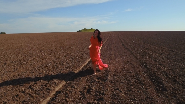 Happy Beautiful Woman in Red Dress Running through Plowed Field, Stock ...