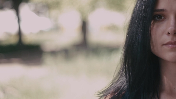 Half Face Portrait of Young Woman Brunette Looking at the Camera and ...