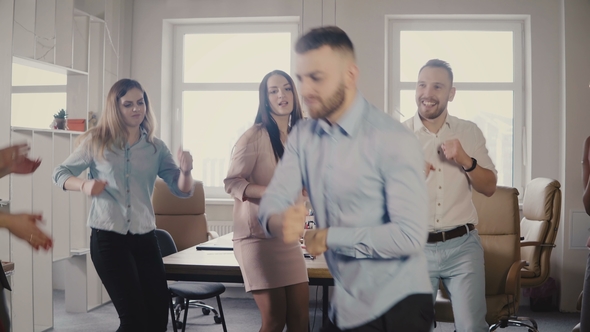 Young European Businessman Dancing Together with Colleagues at Fun ...