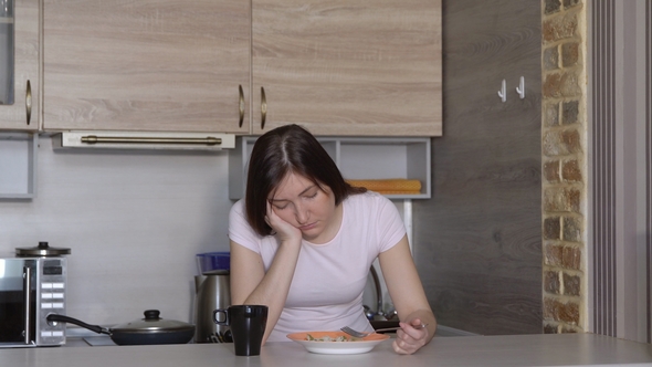 Young Woman, Falling Asleep, Eating at the Table in the Kitchen, Stock ...
