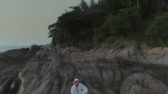 Man in White on Sunset Beach in Thailand Rocks, Stock Footage | VideoHive