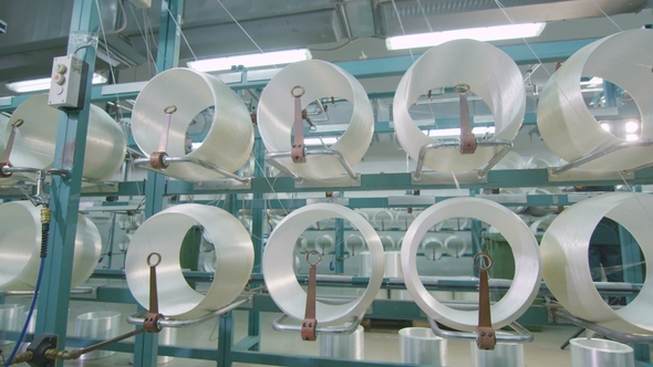 Threads Unwind Passing Through Golden Ring, Stock Footage | VideoHive