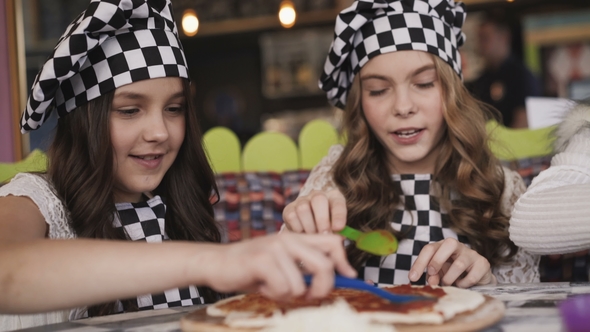Cheerful Girls in Uniform Cooking a Pizza, on Master Class of Chief in ...