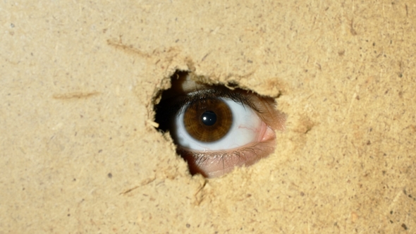 Female Eye Looking Through Hole in Wall, Stock Footage | VideoHive