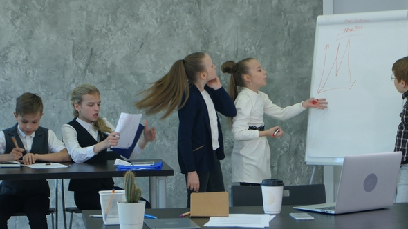 Kids Working Hard in Office, Discussing Serious Problems Together ...