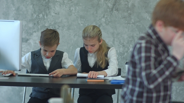 Kids Working with Documents and Laptop in Office, Stock Footage | VideoHive