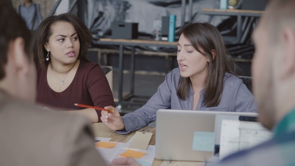 Mixed Race Team Working Together on Architectural Design in Modern Co ...