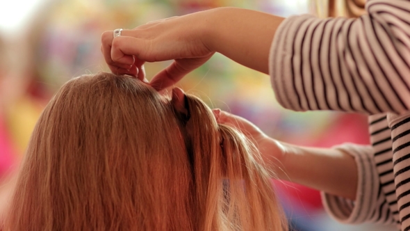 Process of Weaving Braids on Girl's Head Indoors, Stock Footage | VideoHive