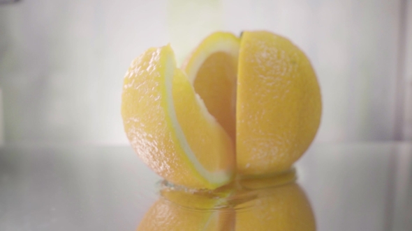 Orange Splits Into Halves on Water. Shot, Stock Footage | VideoHive