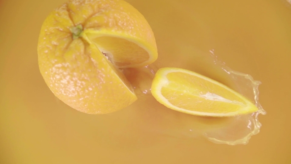 Orange Splits into Slice on Juice, Stock Footage | VideoHive
