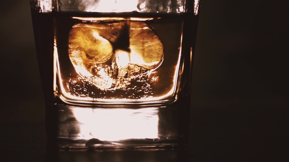 Alcoholic Drink with Ice Cubes in a Glass, Stock Footage | VideoHive