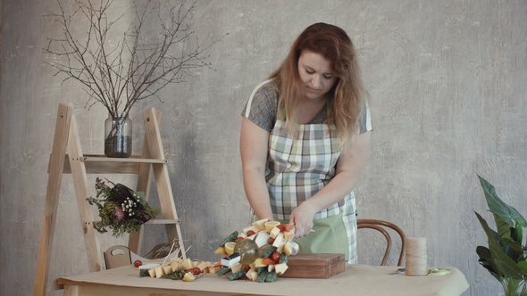 Redhead Woman Making Edible Arrangement at Workplace, Stock Footage