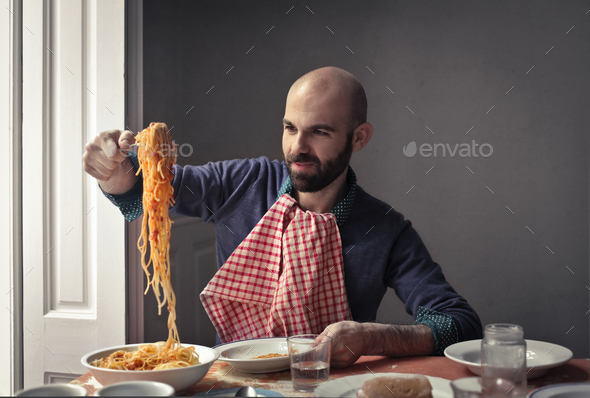 Man eating pasta Stock Photo by ollyi | PhotoDune