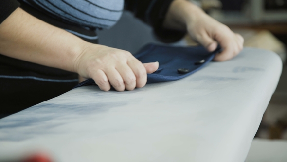Process of Ironing Male Jacket on the Garment Factory., Stock Footage