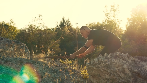 The Brutal Man Beating the Stone with Hammer on the Rock, Stock Footage