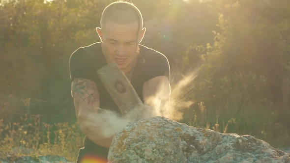 The Brutal Man Beating the Stone with Hammer on the Rock, Stock Footage