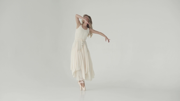 A Graceful Ballerina Makes Smooth Movements with Her Hands. a Ballet ...