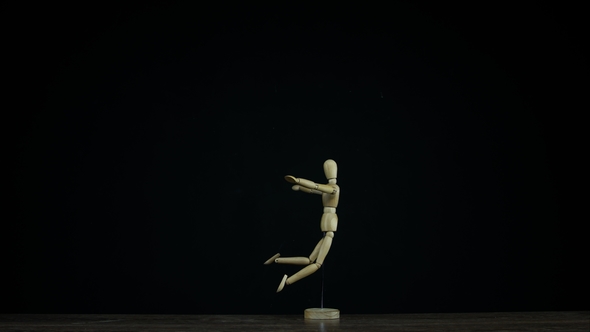 Falling Wooden Figure Dummy in Studio on Black Background Rotating ...