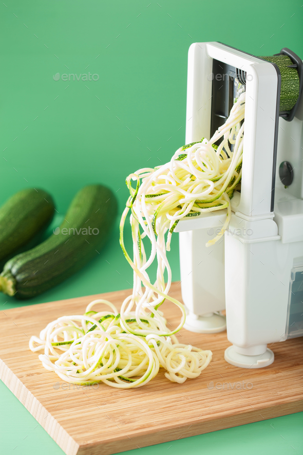 spiralizing courgette raw vegetable with spiralizer Stock Photo by duskbabe