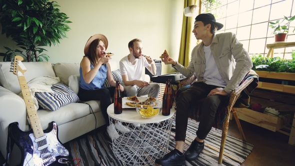 Young Friends Musicians Are Eating Pizza and Talking During Rehearsal ...