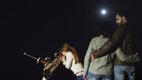Happy Family Watching the Moon in a Telescope at Night, Stock Footage