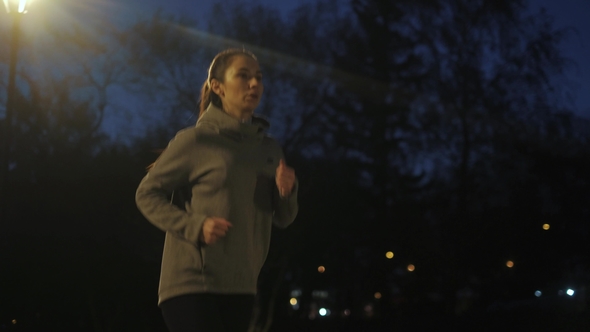 Evening Jog Girl Runs Along the Embankment on the Background of the ...