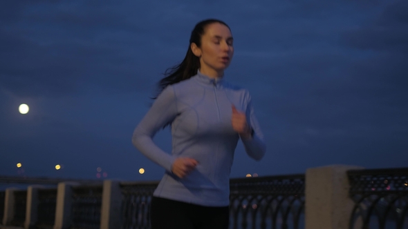 Night Jogging in the Moonlight. a Young Girl Runs Through Deserted ...
