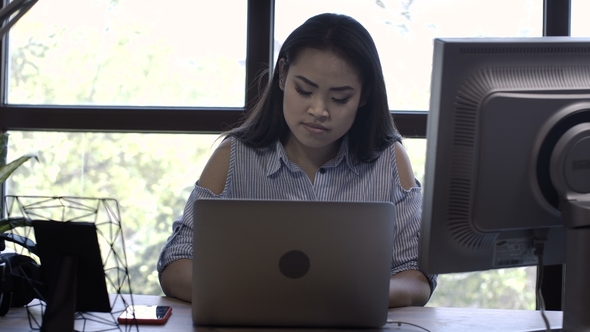 Pretty Ethnic Girl Working at Computer Desk, Stock Footage | VideoHive