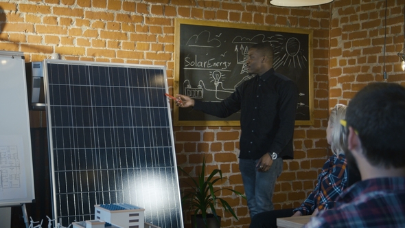 Black Man Presenting Modern Solar Battery, Stock Footage | VideoHive