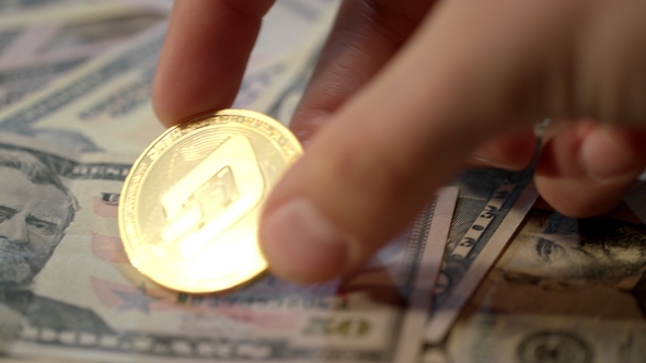 Human Hand Take Gold Dashcoin with Dollar Banknotes, Stock Footage