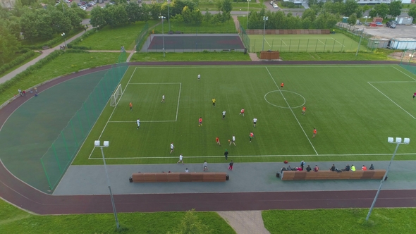 Green Soccer Field. Players Playing Football. Aerial View. Flying ...