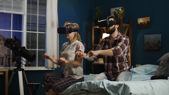 Couple in VR Glasses Having Fun on Bed, Stock Footage | VideoHive