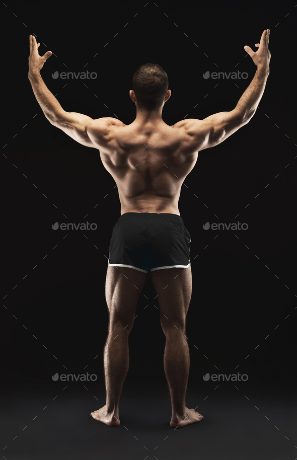 Unrecognizable man shows strong back muscles closeup Stock Photo by ...
