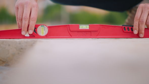 An Engineer Checks the Construction Accuracy with the Help of a Bubble ...