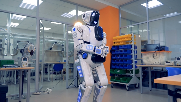 One Android Stands in a Room with Equipment, Stock Footage | VideoHive