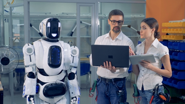 People Use Devices To Test a Robot, Stock Footage | VideoHive