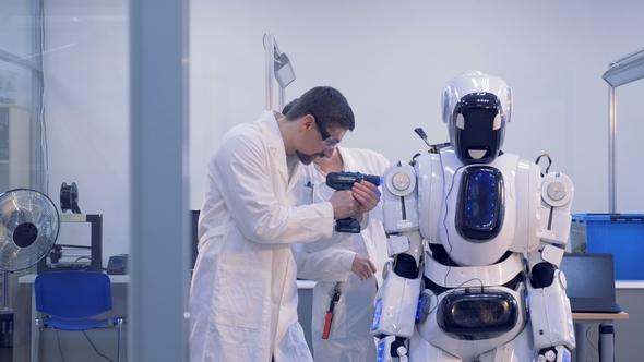 Workers Fix a Robot, Stock Footage | VideoHive