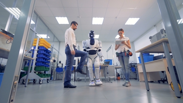 White Robot Copies Movements of a Man, Stock Footage | VideoHive