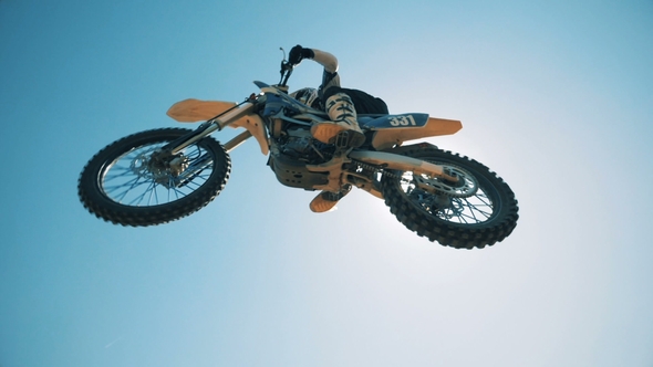 A Motorcycler Is Flying Over on His Bike After Jumping, Stock Footage