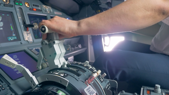 Throttle Lever Is Getting Pulled By a Pilot of an Aircraft, Stock Footage