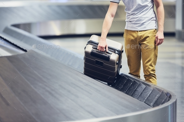 Suitcase on baggage claim Stock Photo by Chalabala | PhotoDune